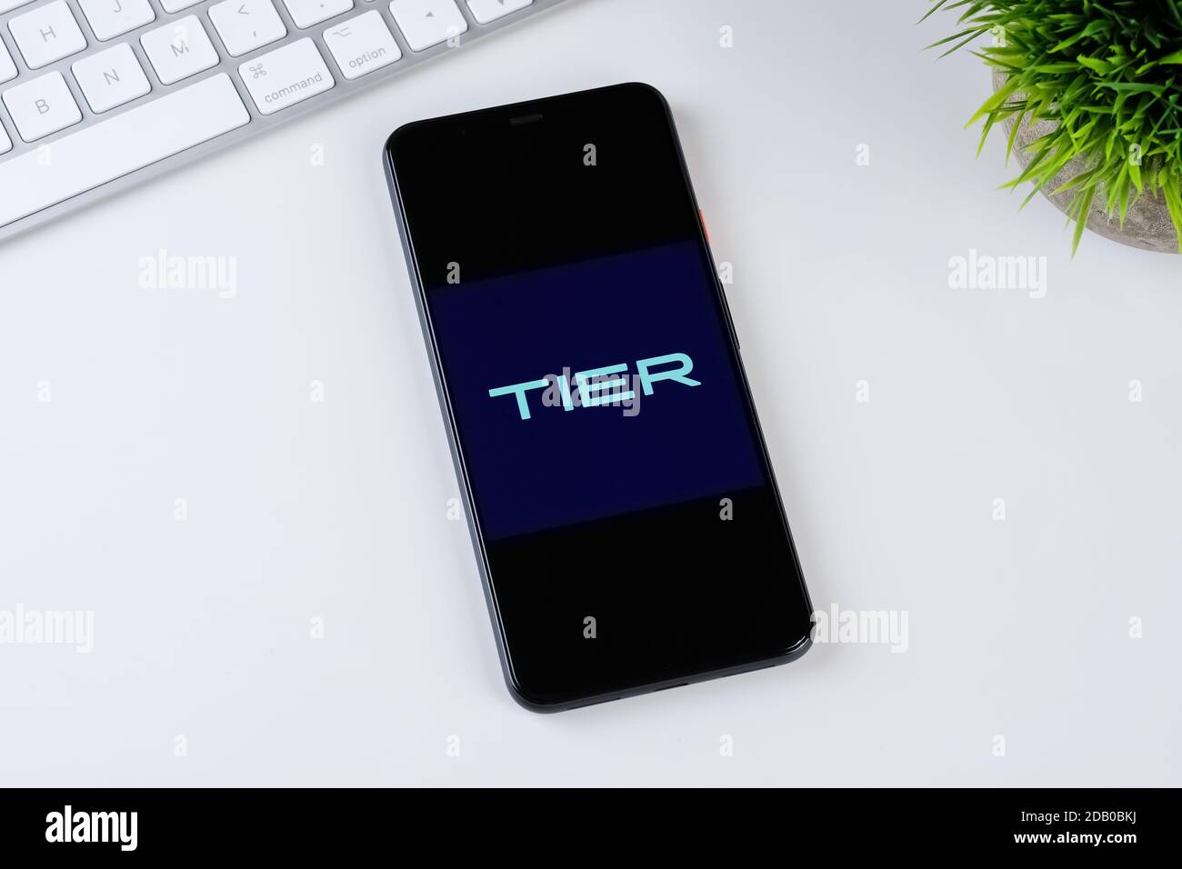 TIER e-scooter sharing & more app logo on a smartphone screen Stock ...