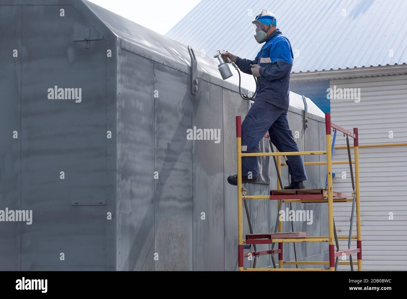 Industrial work. Priming of metal products from the compressor gun. A ...