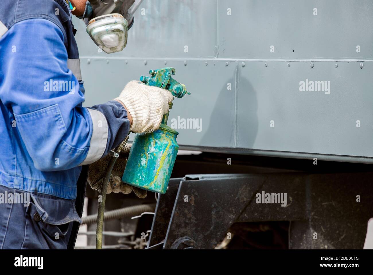 Industrial work. Priming of metal products from the compressor gun ...