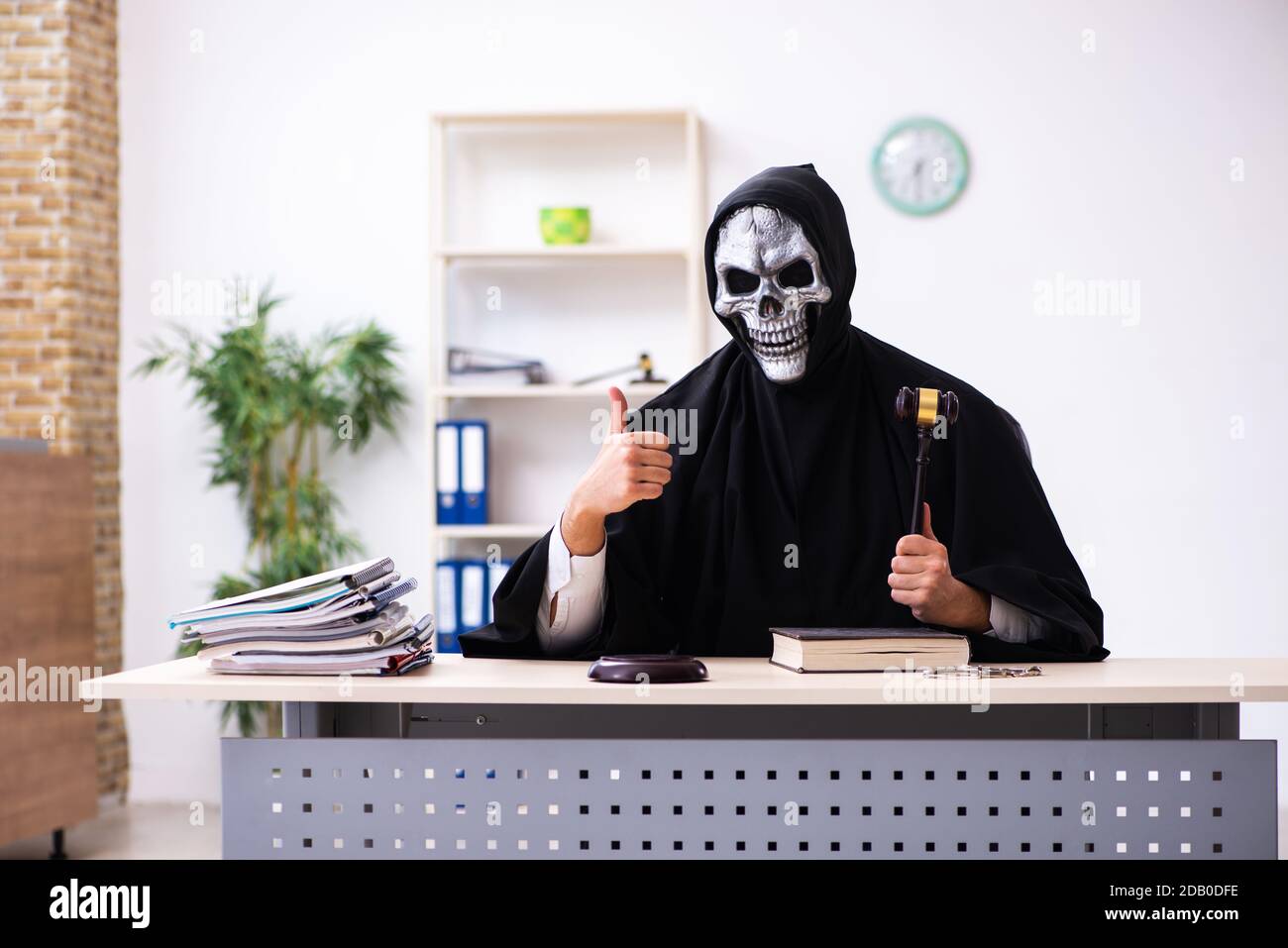 Devil judge working in the courthouse Stock Photo - Alamy