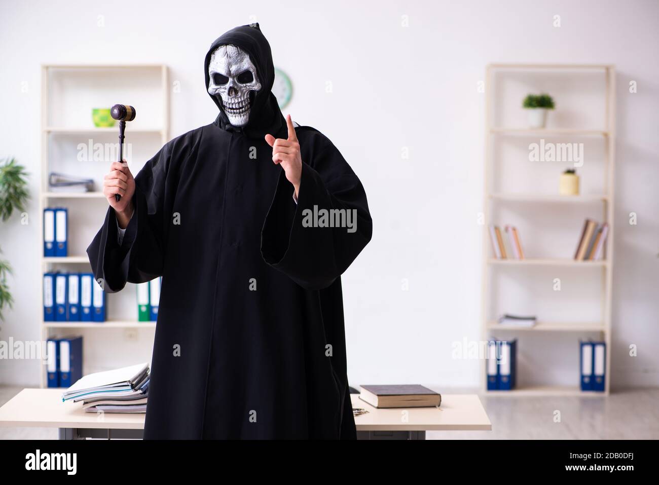 Devil judge working in the courthouse Stock Photo - Alamy