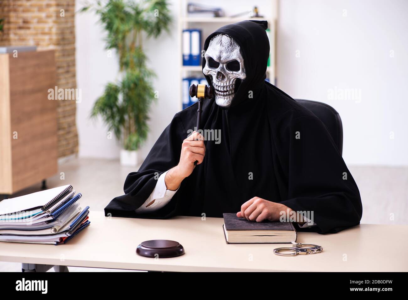Devil judge working in the courthouse Stock Photo - Alamy