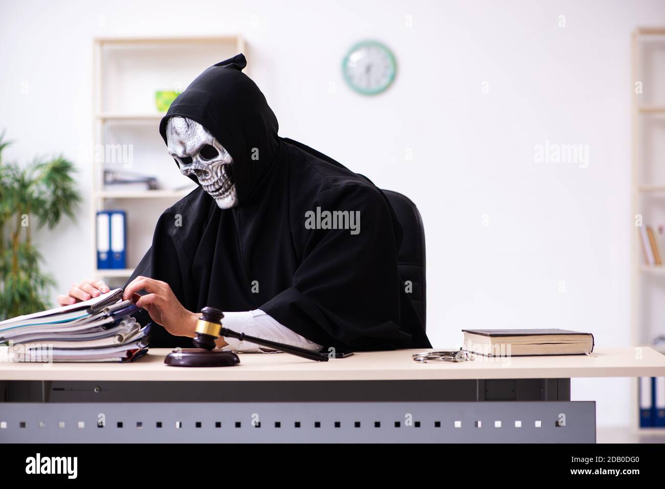 Devil judge working in the courthouse Stock Photo - Alamy