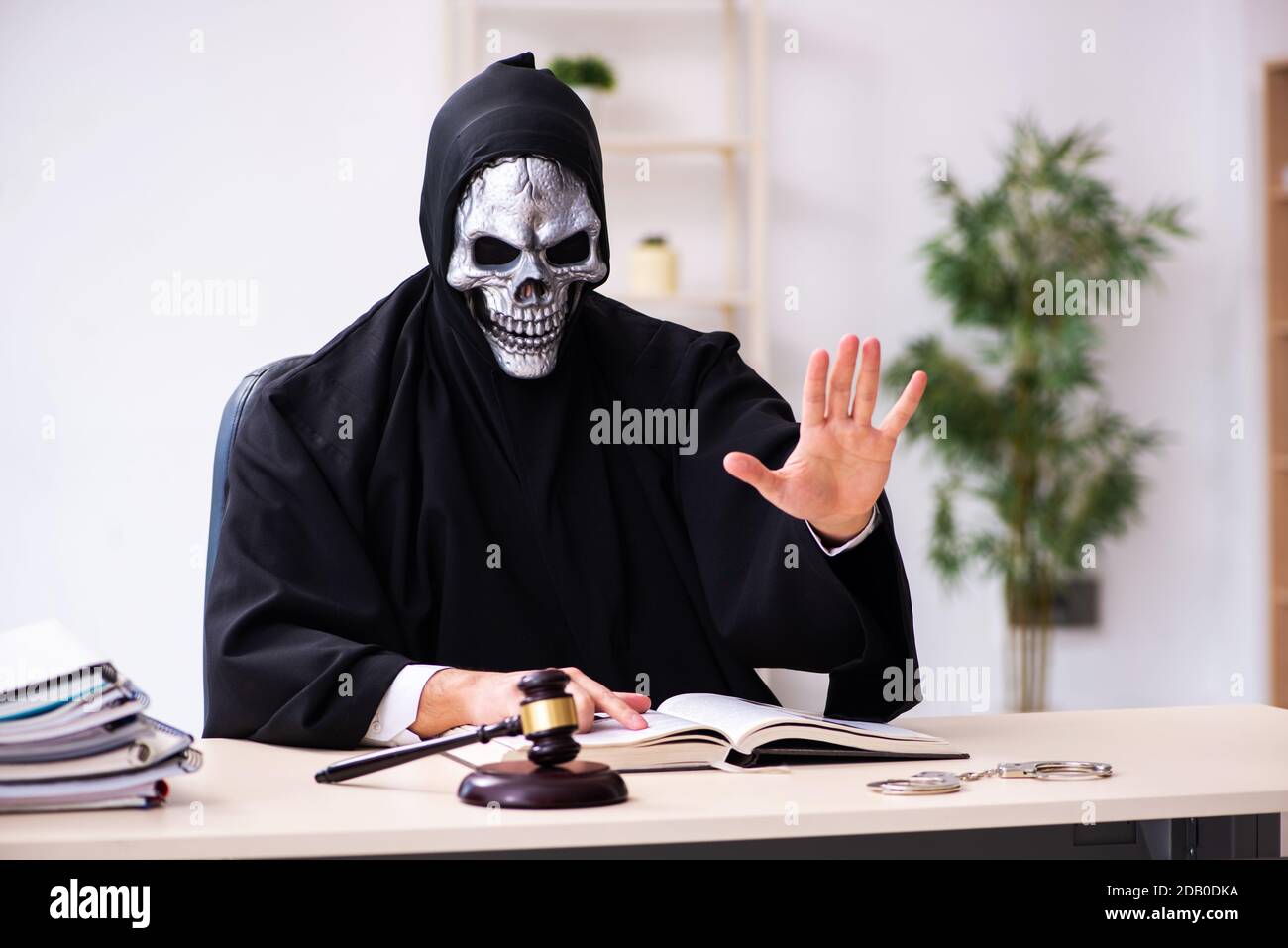 Devil judge working in the courthouse Stock Photo - Alamy