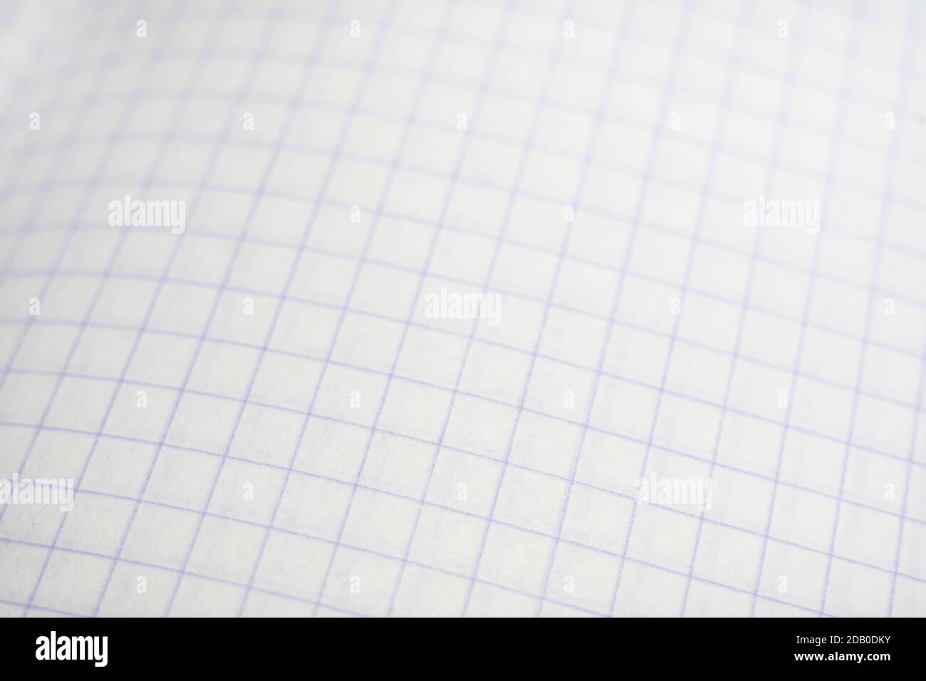 blurred background of a checkered notebook sheet Stock Photo - Alamy