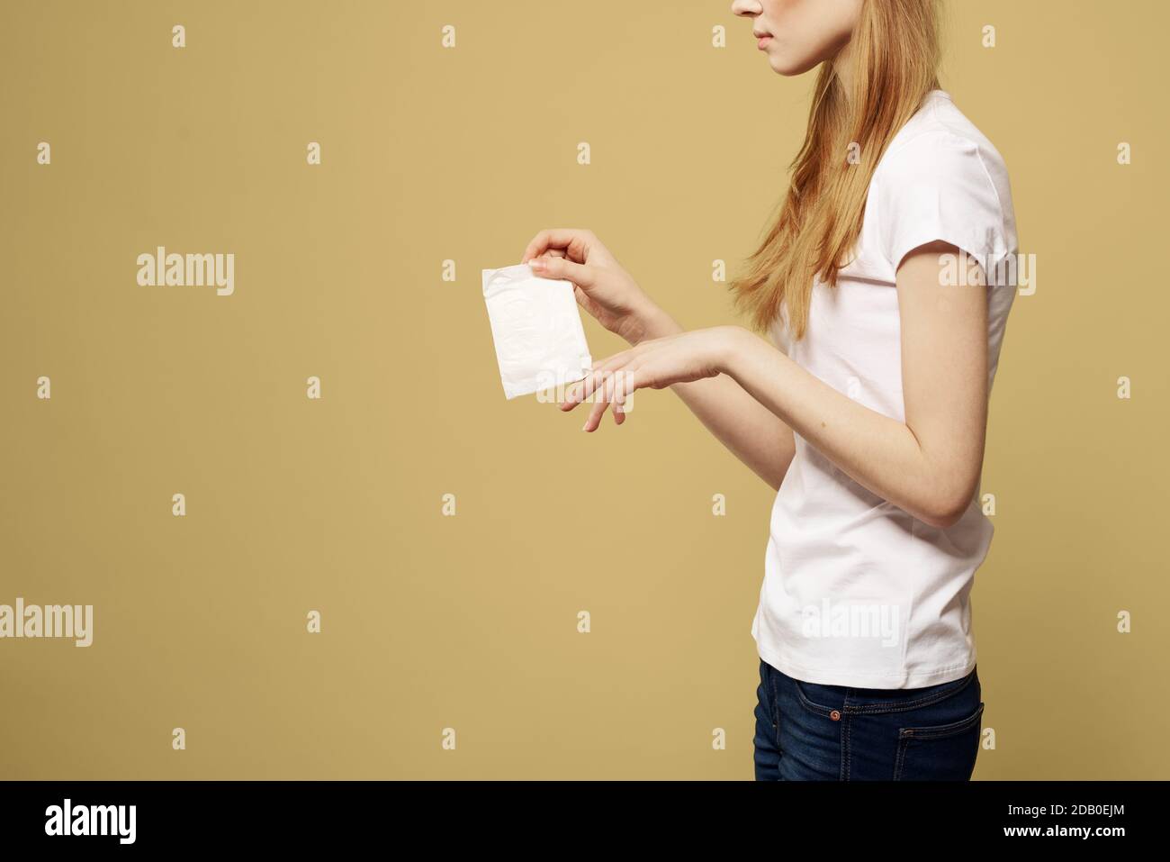 Woman with pad in hand on beige background cropped side view Stock ...