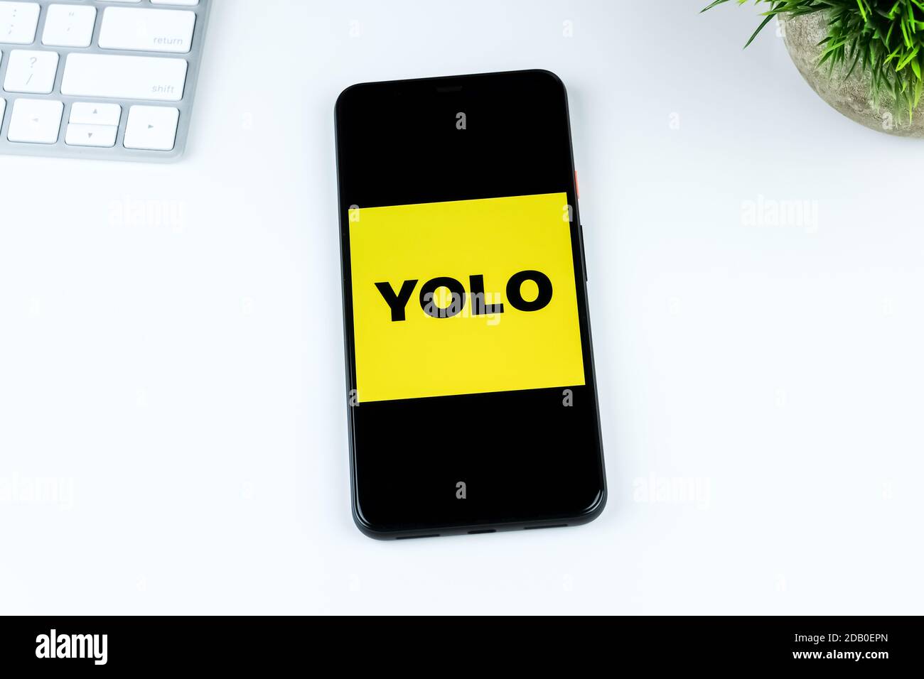 YOLO: Anonymous Q&A app logo on a smartphone screen Stock Photo - Alamy