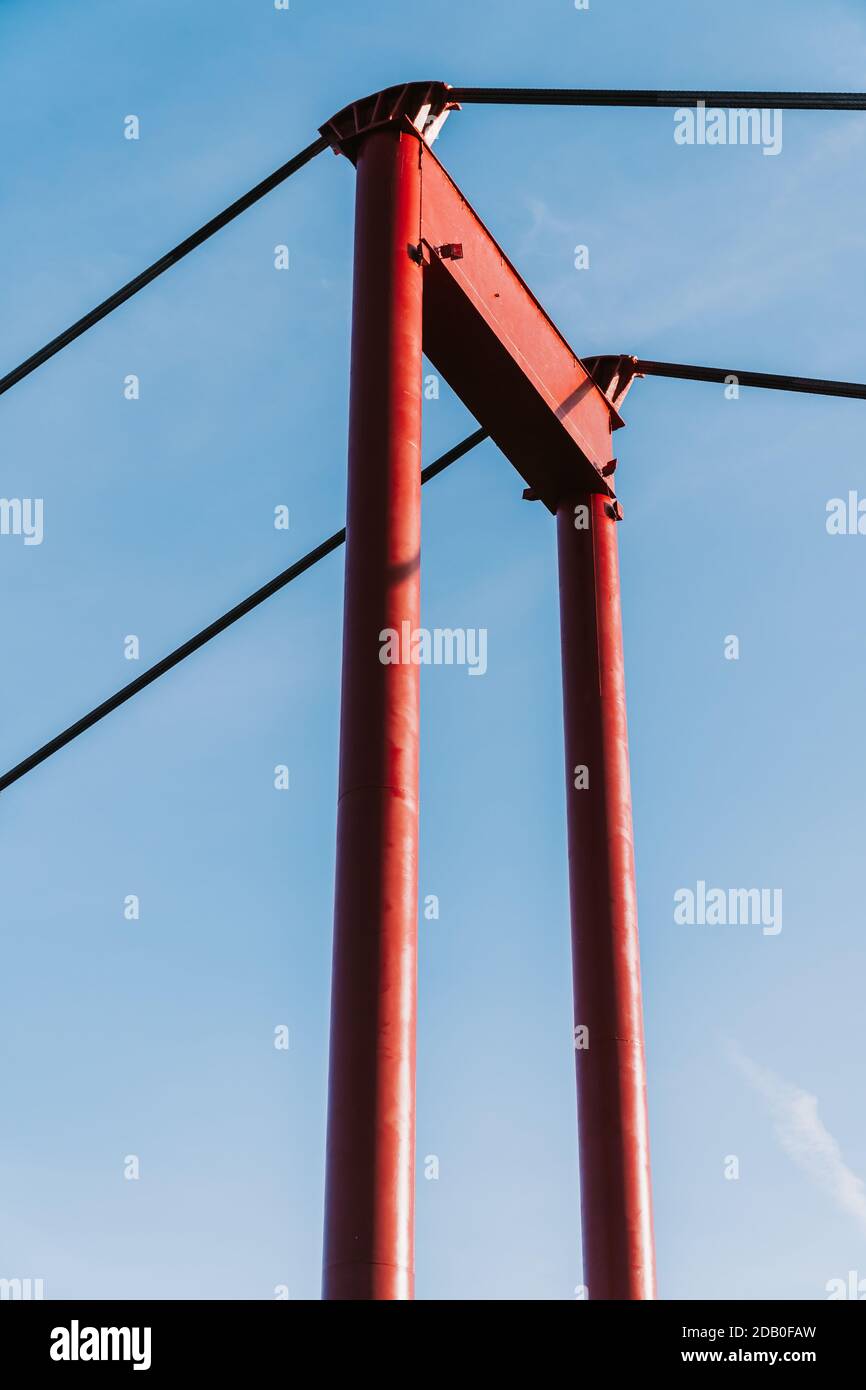 The bridge columns are red against the blue sky Stock Photo - Alamy
