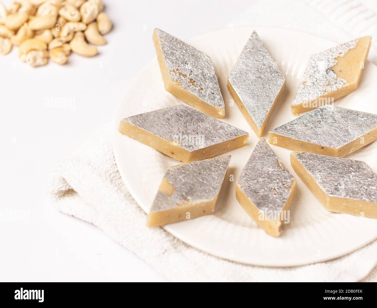 Kaju katli / kaju barfi is a diamond shape indian sweet made with using ...