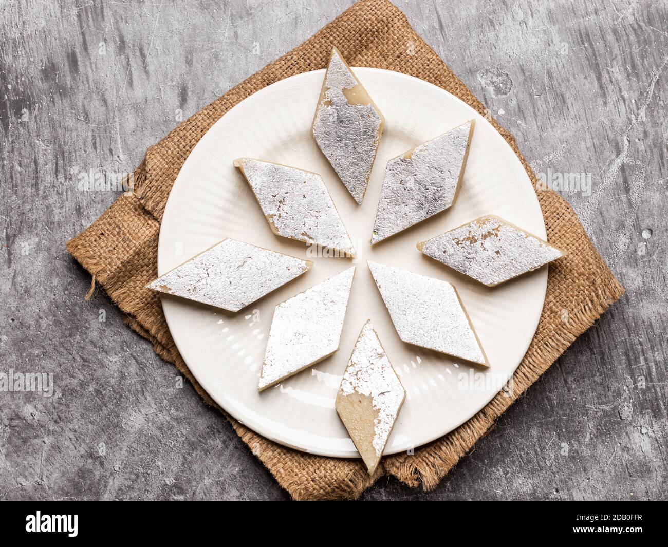 Kaju katli / kaju barfi is a diamond shape indian sweet made with using ...