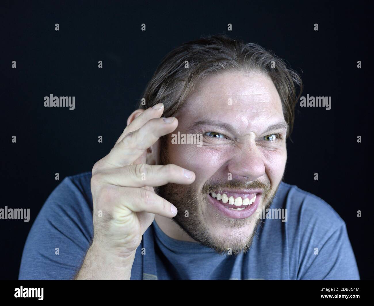 Close-up shot of a male making a goofy face Stock Photo - Alamy