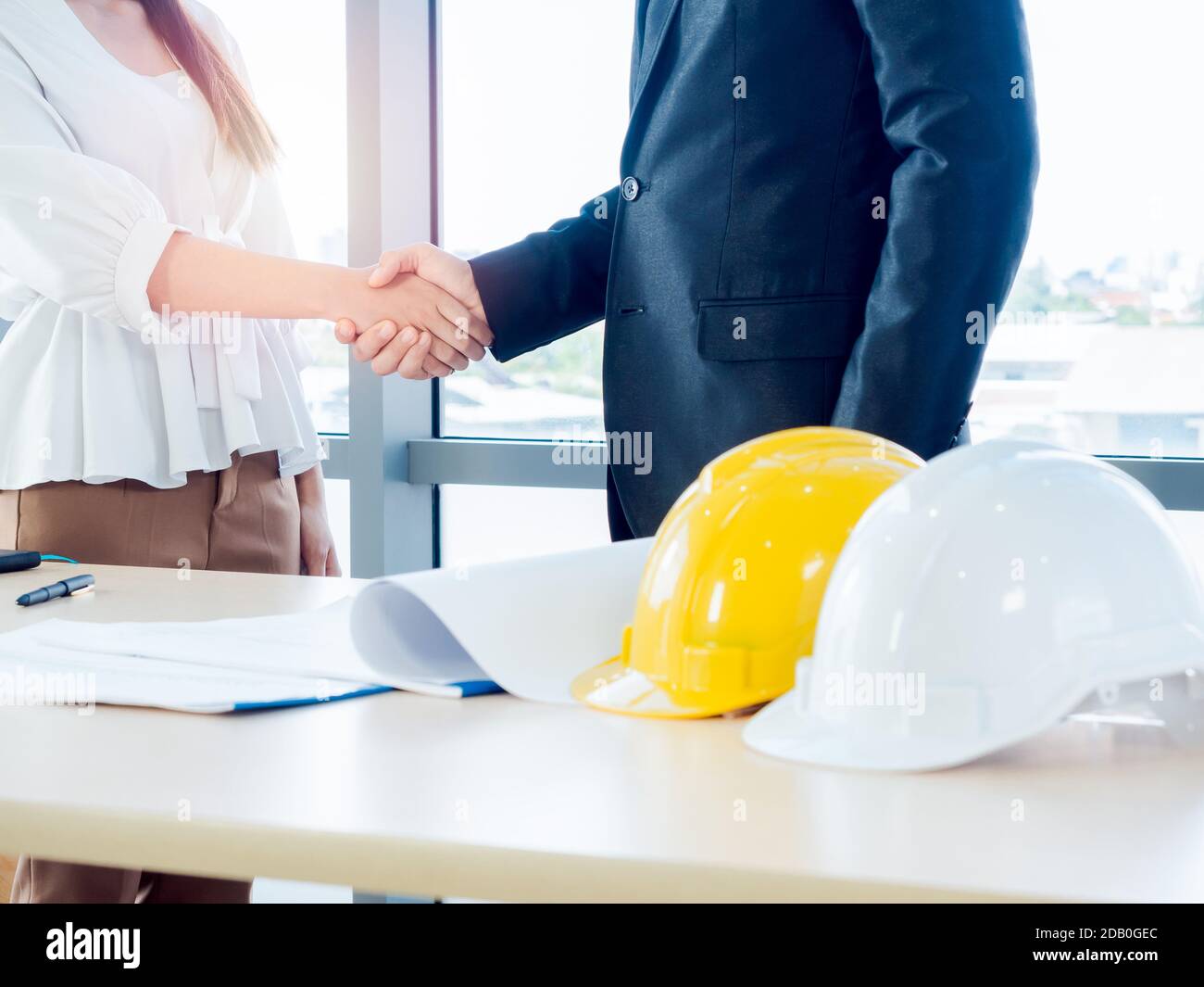Handshake of collaboration concept. Businessman in suit, engineering or ...