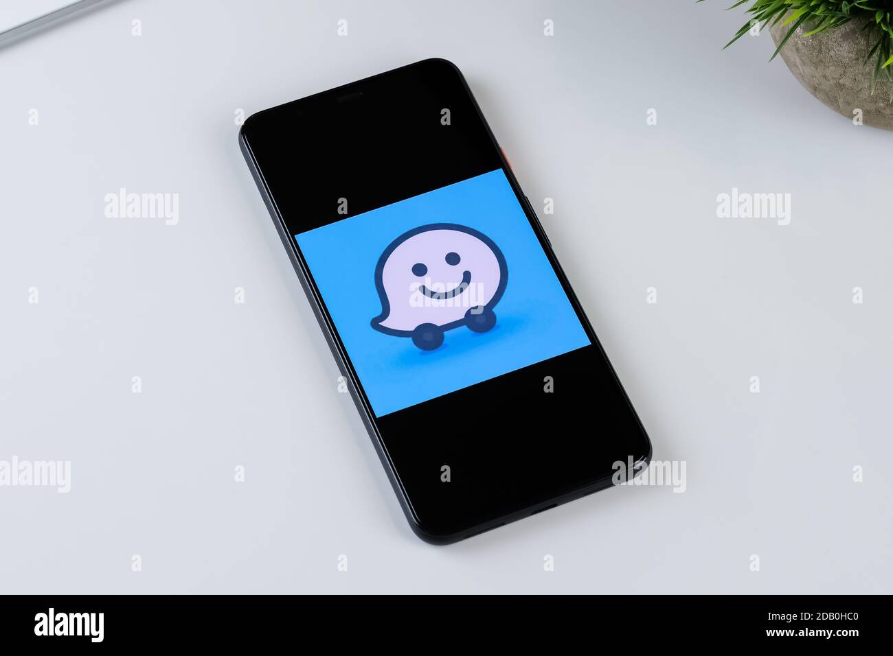 Waze app logo on a smartphone screen Stock Photo - Alamy