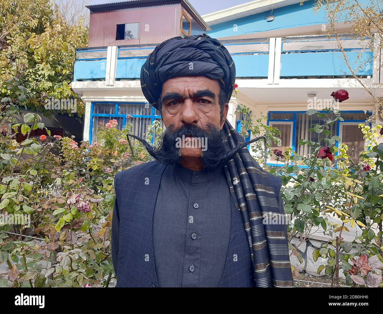 Kabul, Afghanistan. 13th Nov, 2020. The Afghan tailor Shere Khan shows ...