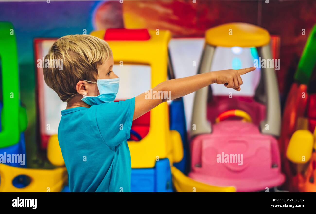 Side Cute blond child boy playground entertainment indoor center ...