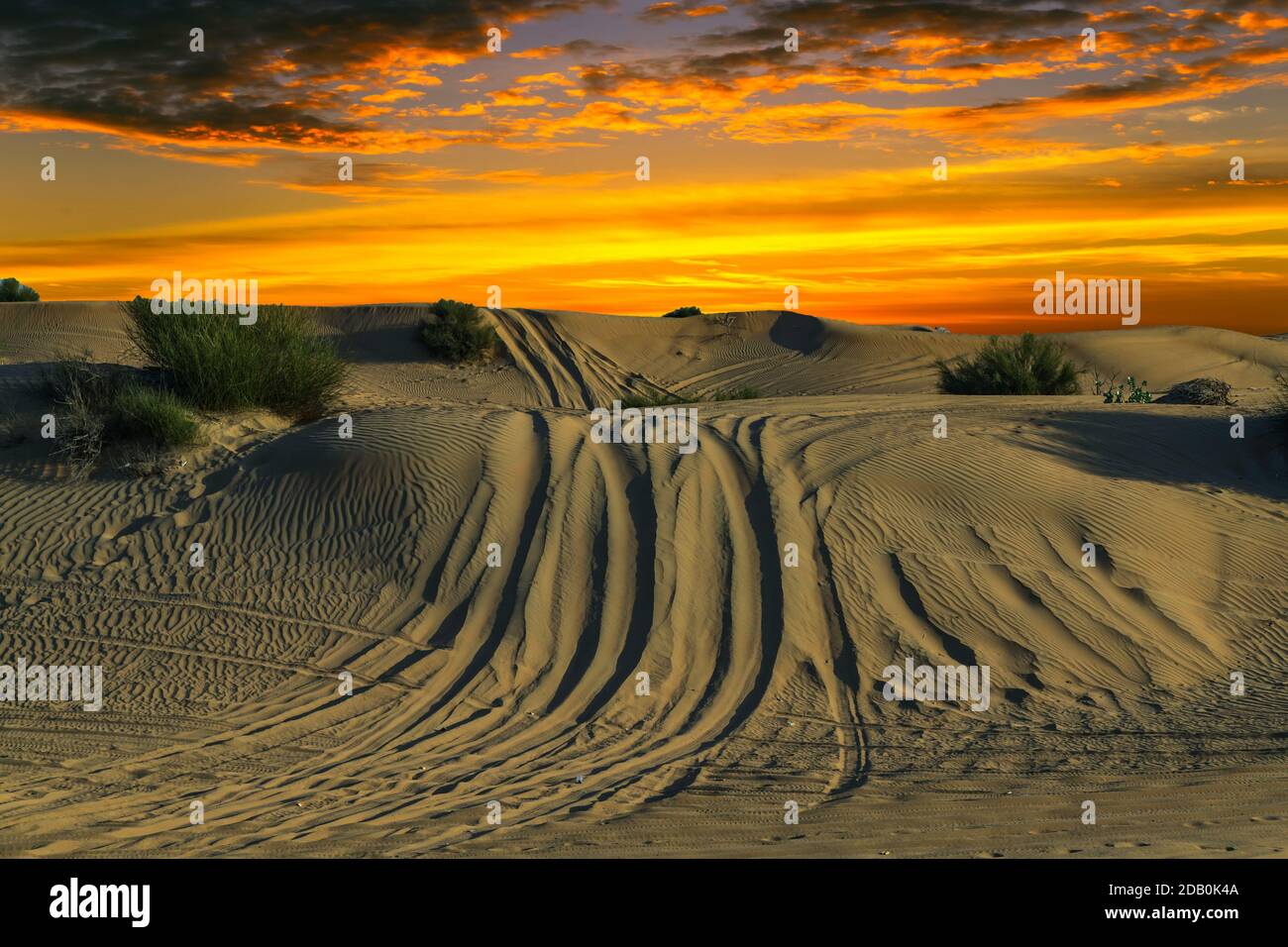 dramatic red sky desert sand dunes landscape with road Stock Photo - Alamy