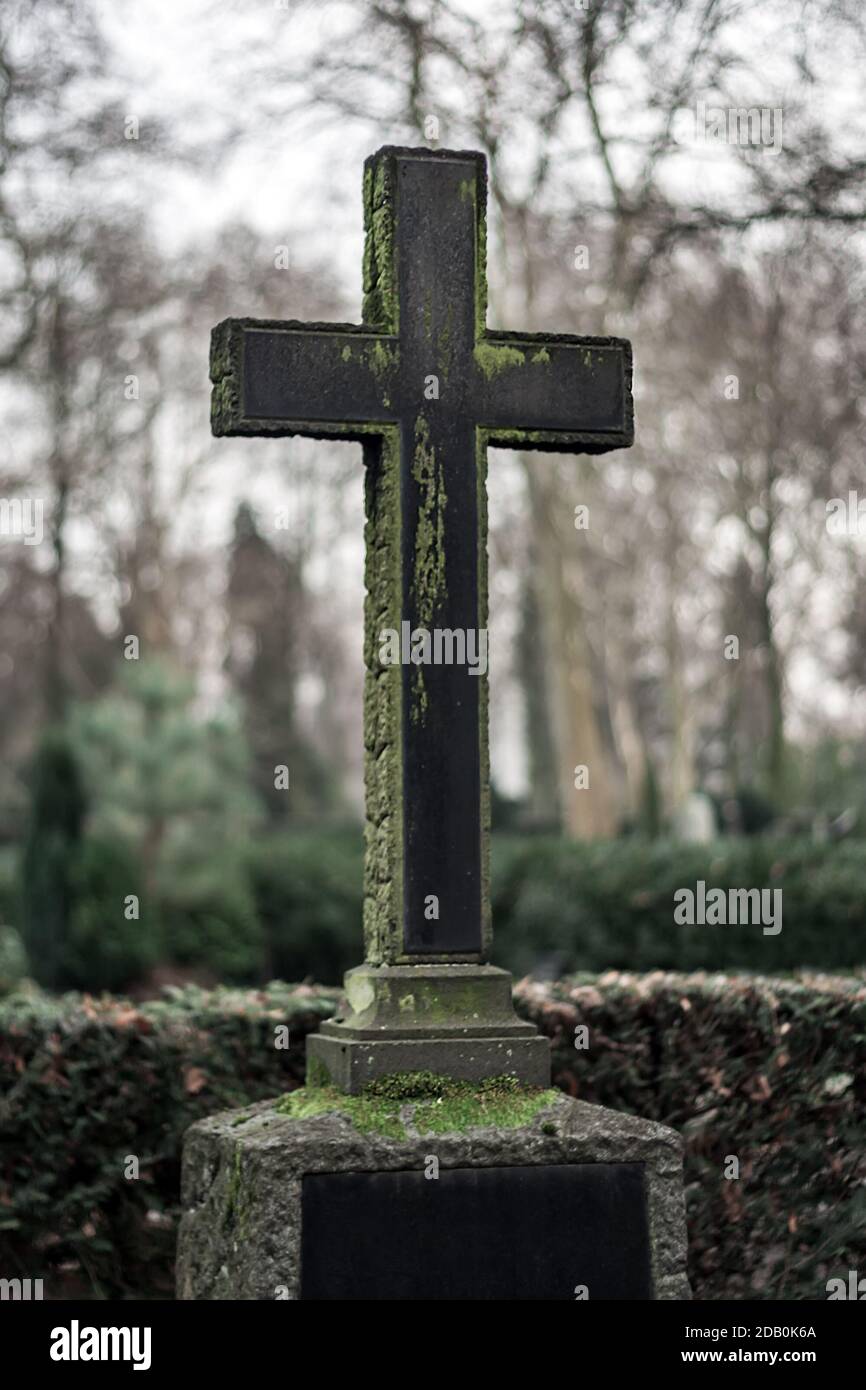 Ancient stone grave cross in old cemetery Stock Photo - Alamy