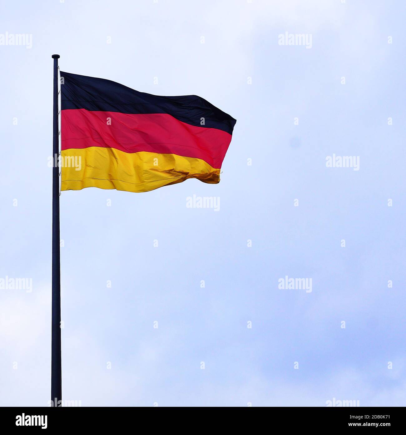 Flag of Germany waving in the wind Stock Photo - Alamy