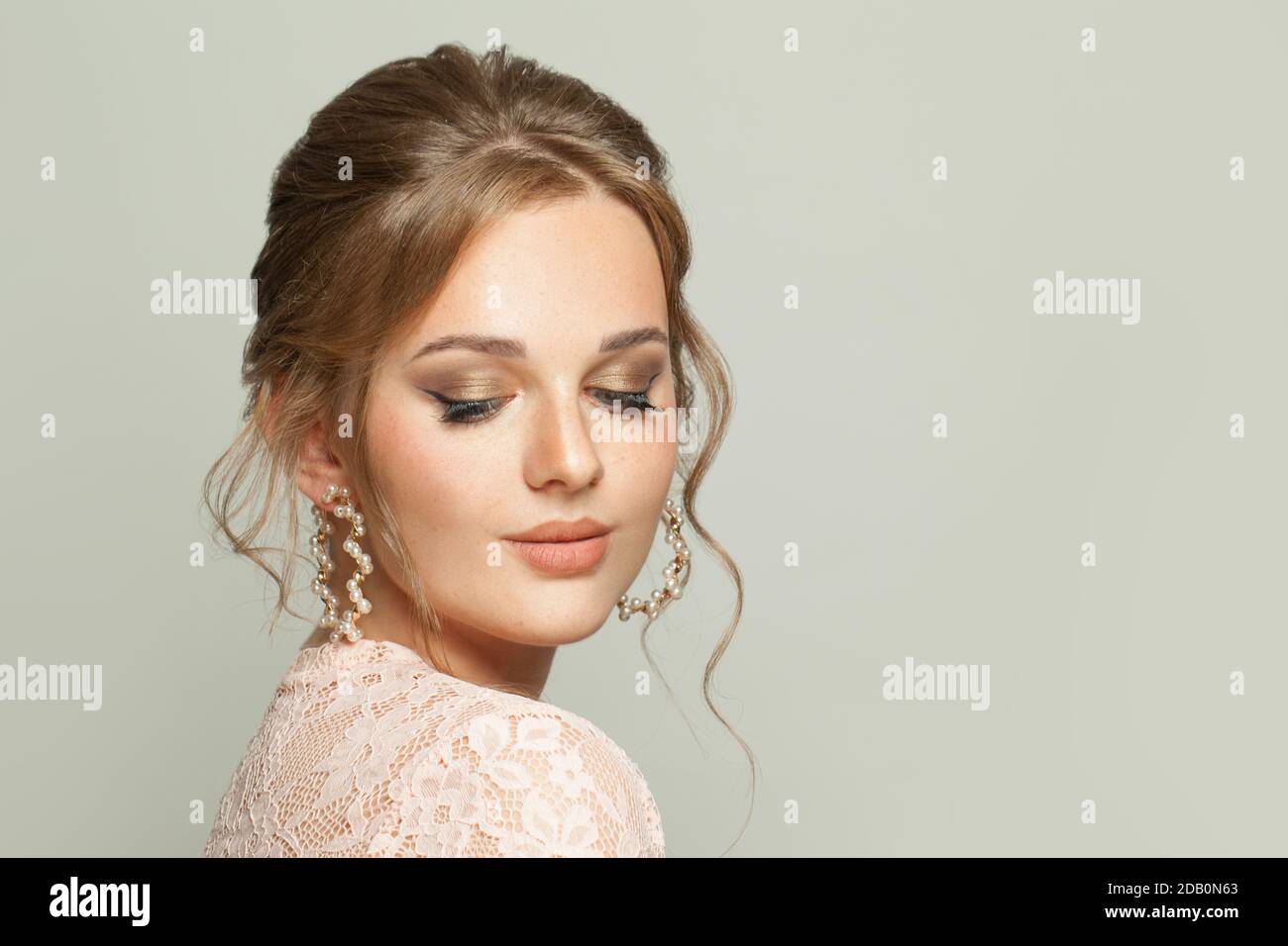 Beautiful woman model face with pastel color makeup on white background ...