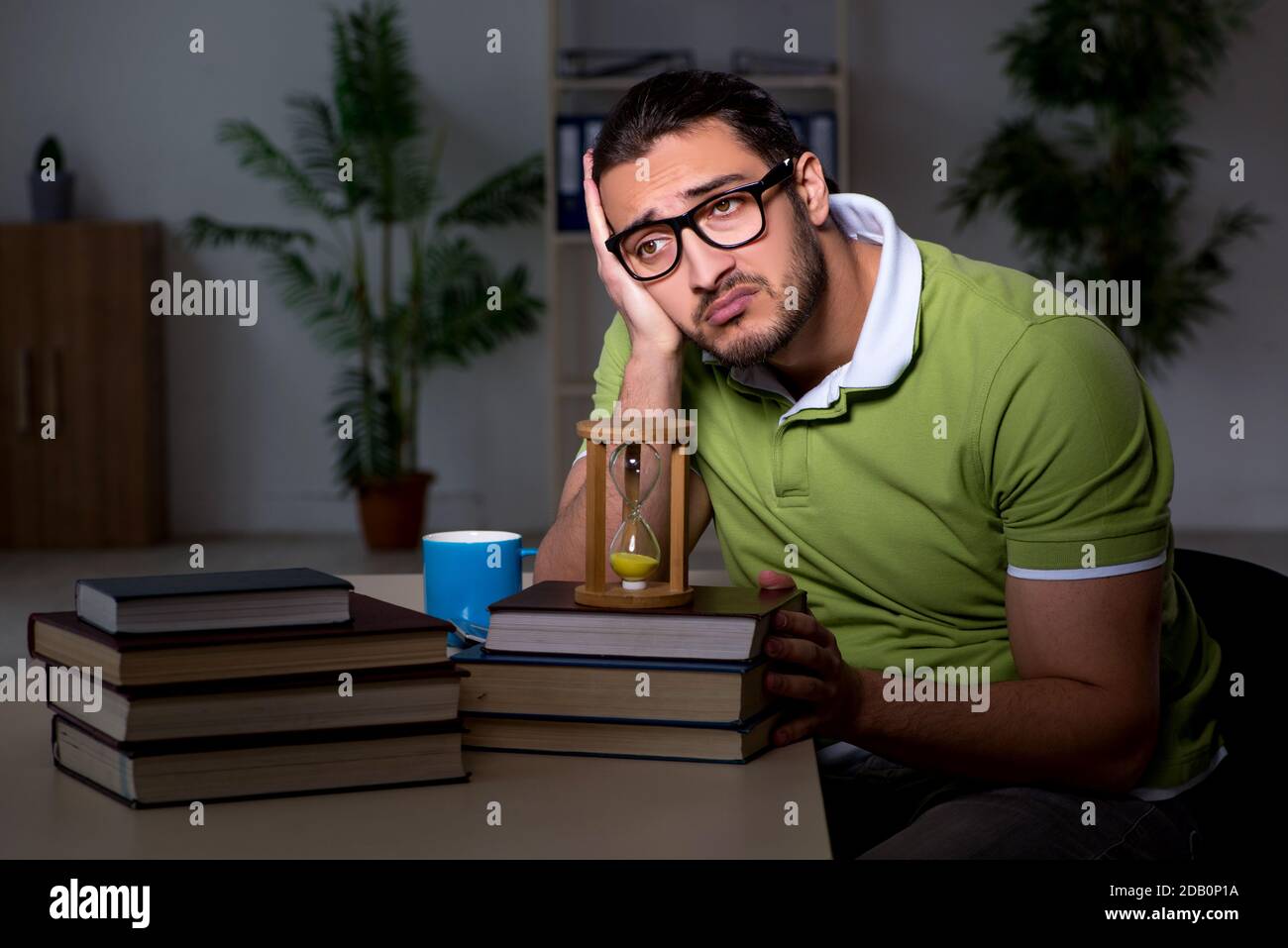 Young student studying at night at the home Stock Photo - Alamy