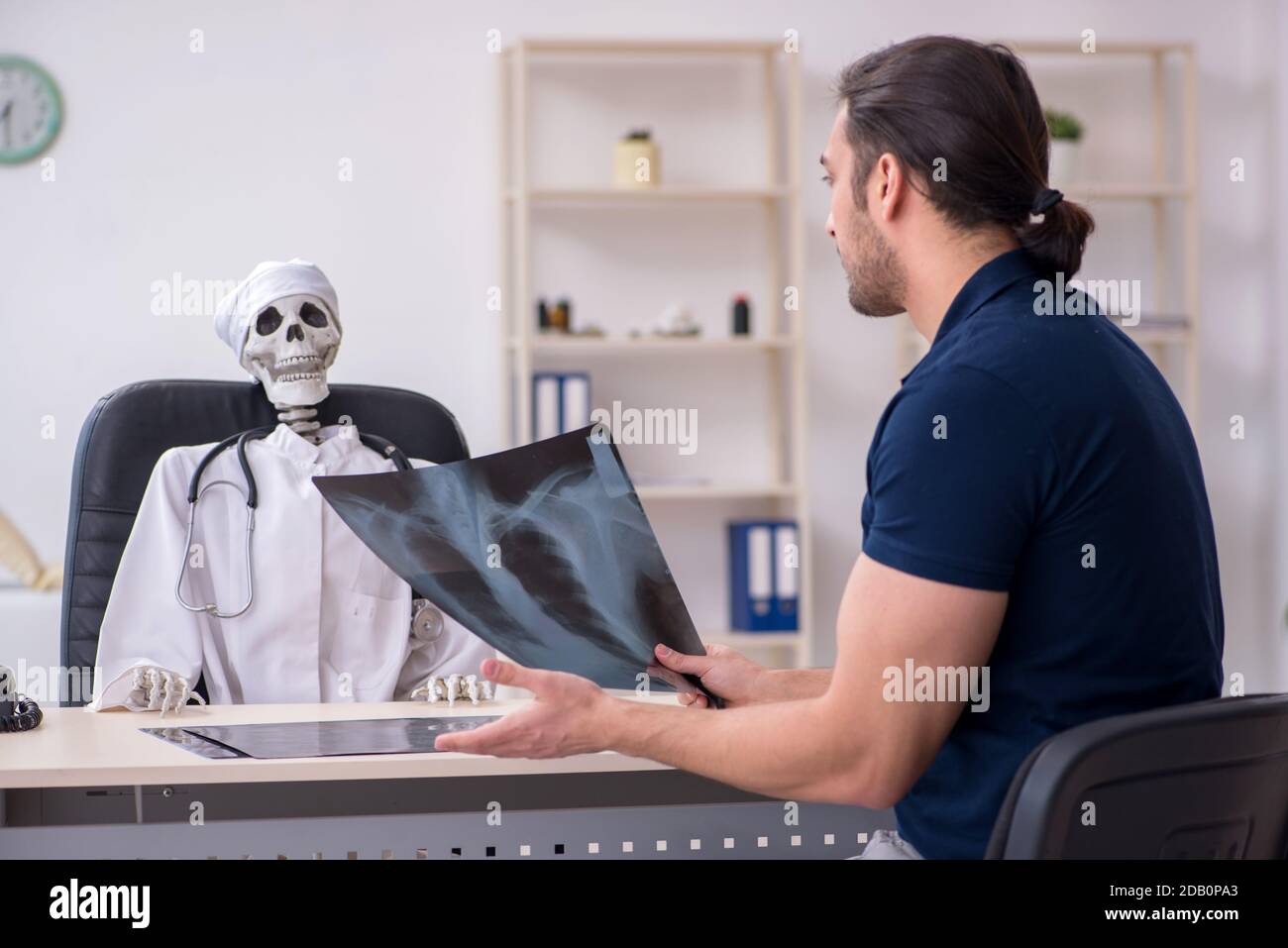 Young man visiting dead doctor in hospital Stock Photo - Alamy