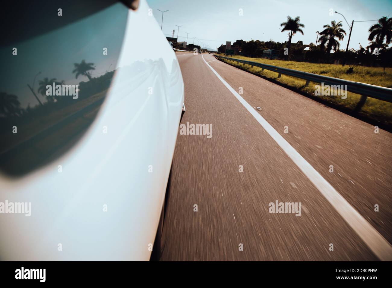 Rear view of the highway taken from a moving vehicle window Stock Photo ...