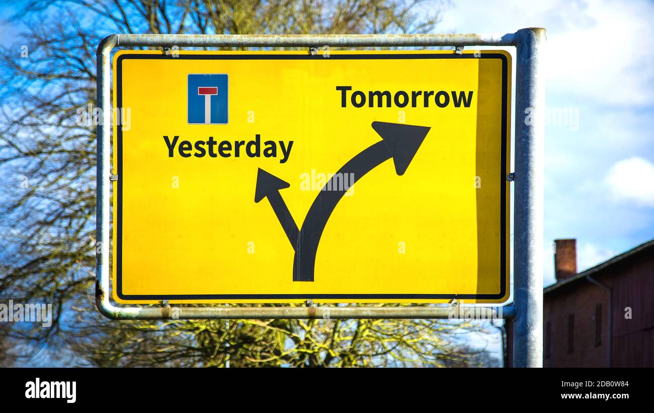 Street Sign the Direction Way to Tomorrow versus Yesterday Stock Photo ...