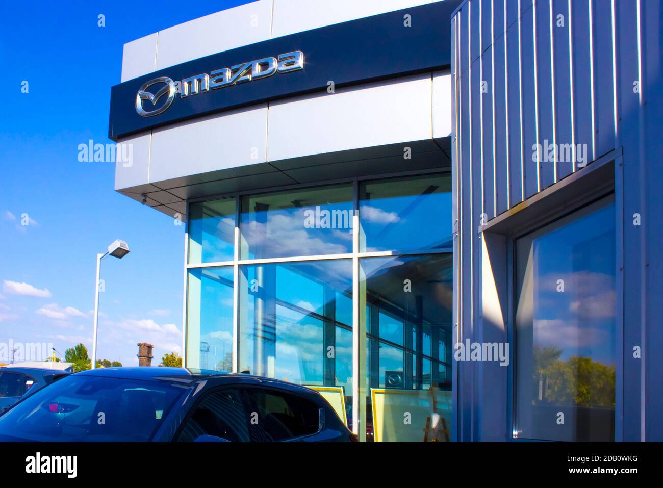Kyiv, Ukraine - August 15, 2020: retail of Mazda logo on store front ...