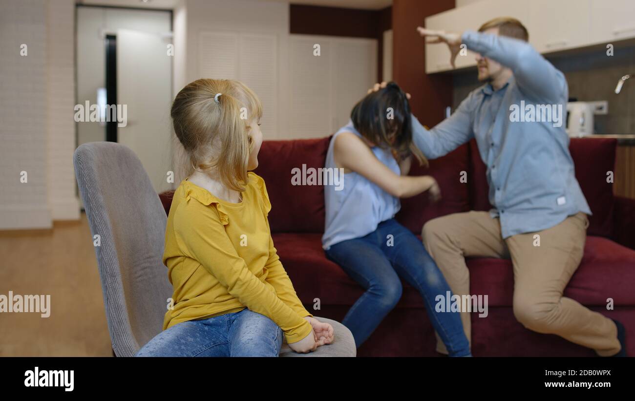 Caucasian child girl kid is suffering and crying from quarrels between ...
