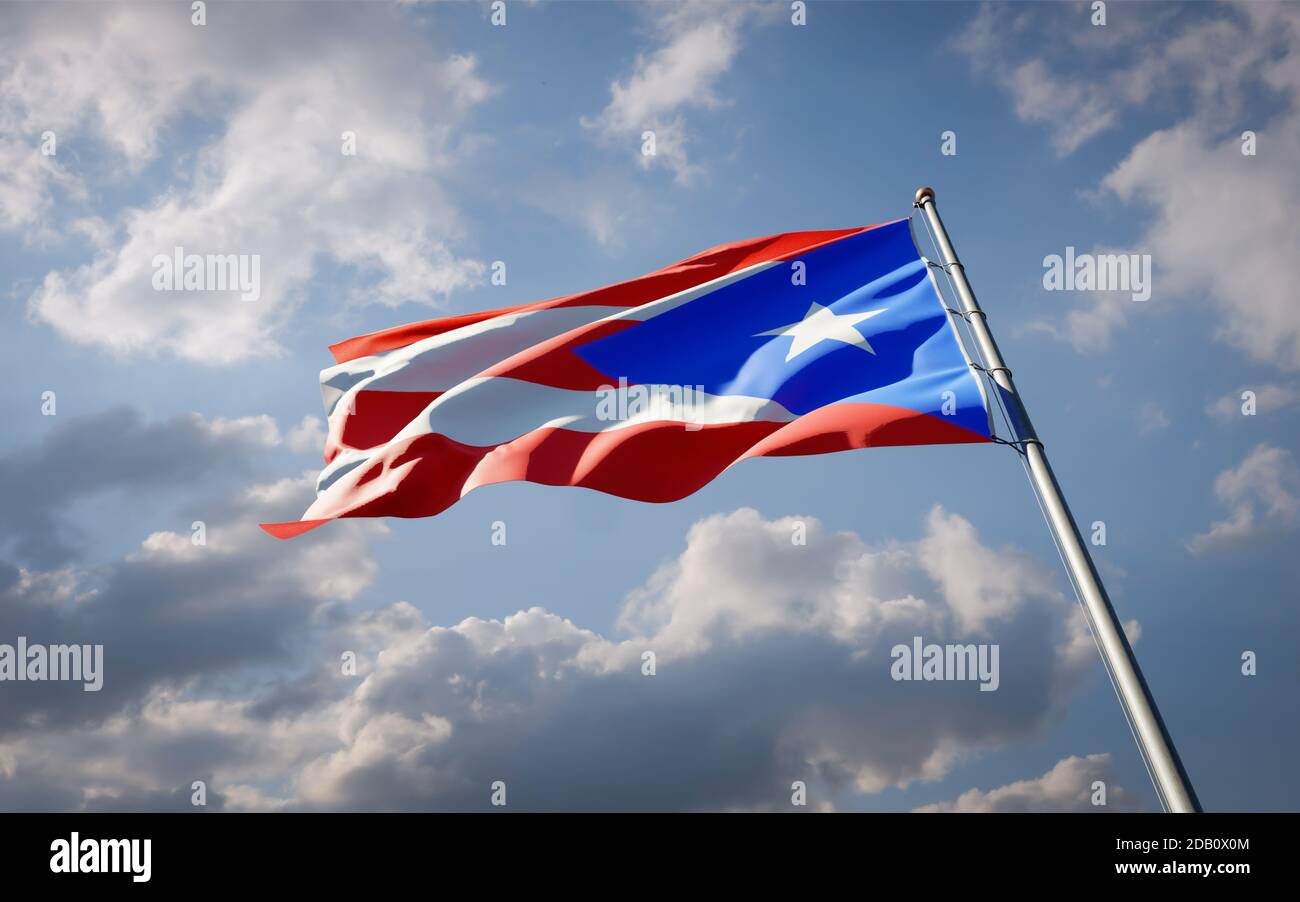 Beautiful national state flag of Puerto Rico fluttering at sky ...