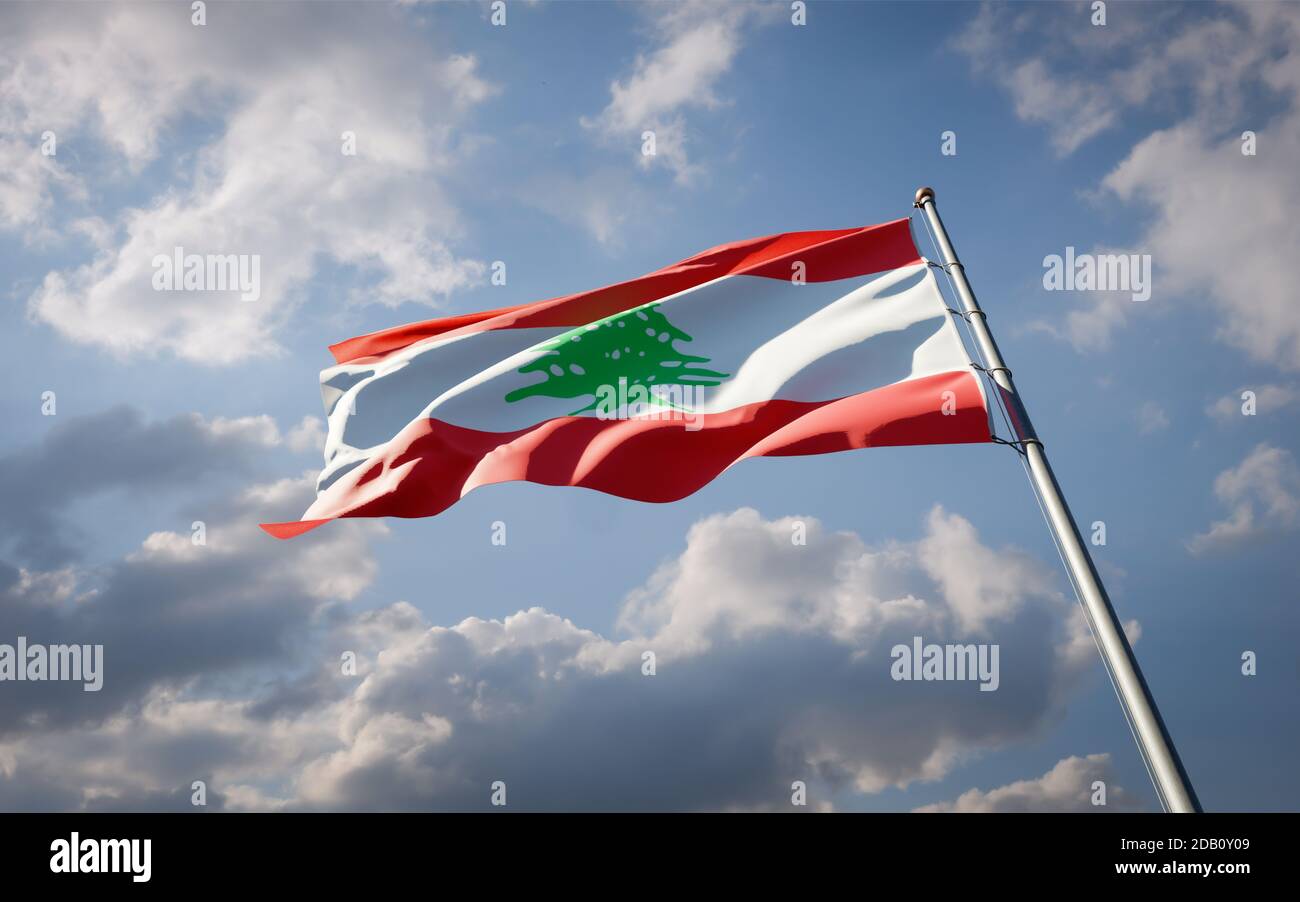 Beautiful national state flag of Lebanon fluttering at sky background ...