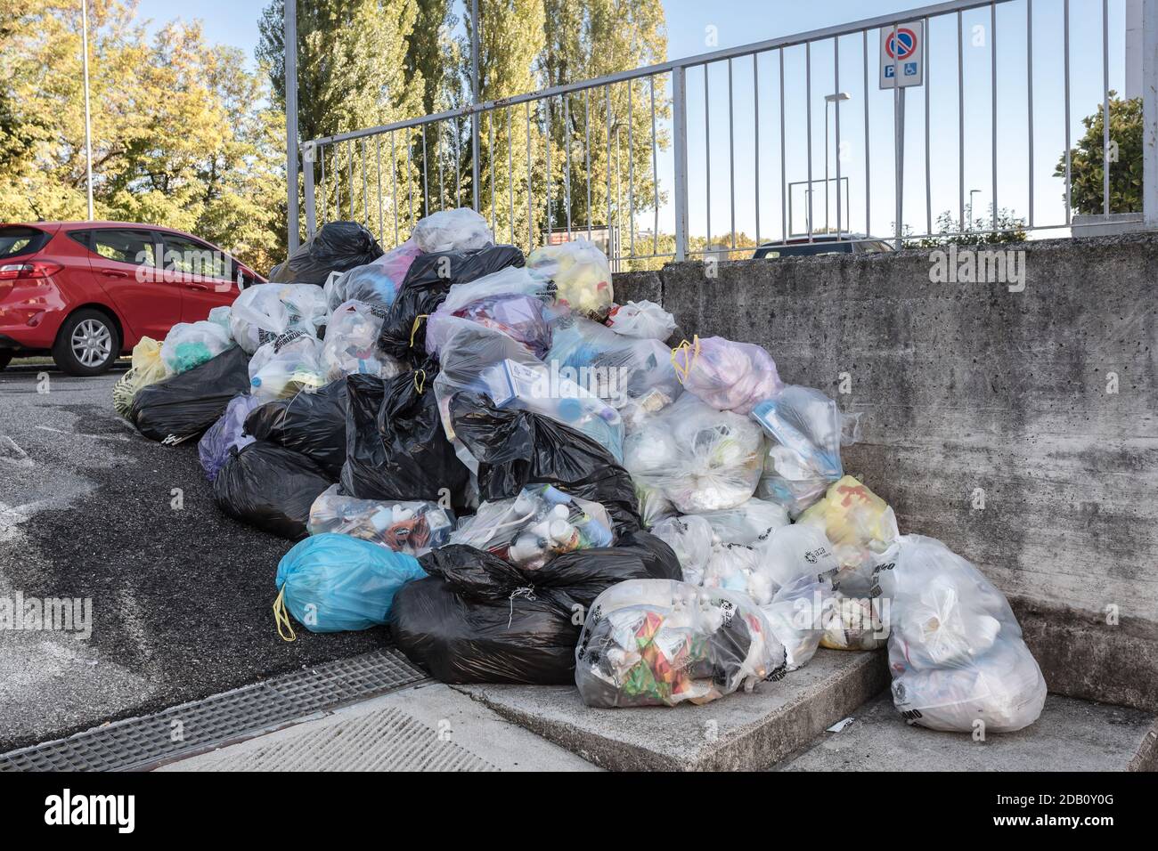 Road and footpath full of garbage / Dirty street. Bergamo, ITALY ...