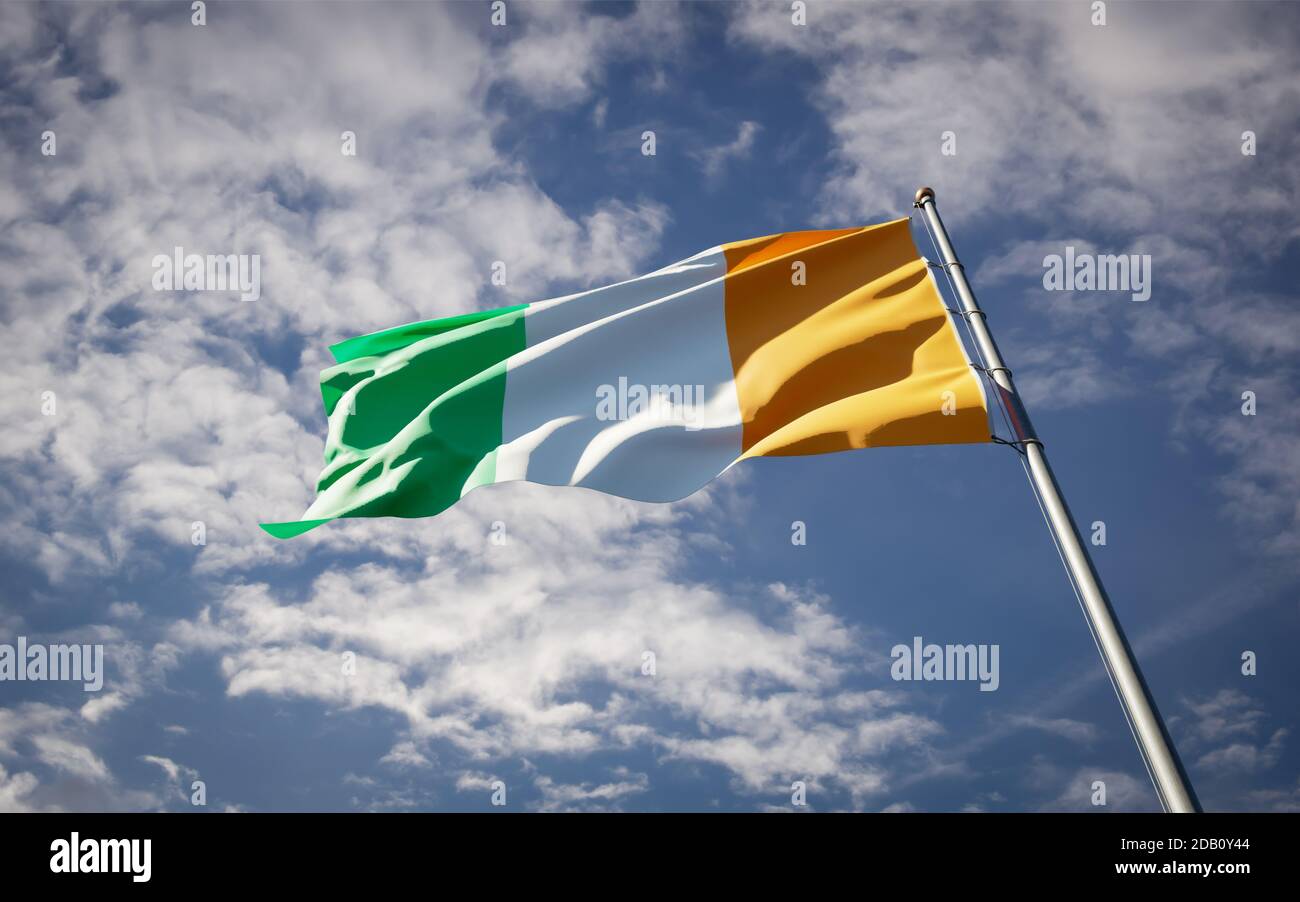 Beautiful national state flag of Cote dVoire fluttering at sky ...