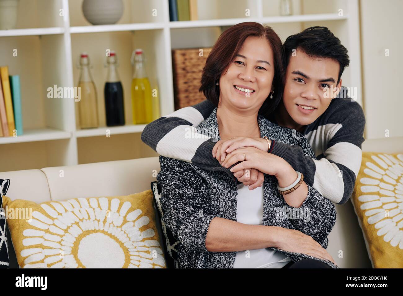 Young man hugging his mother Stock Photo - Alamy