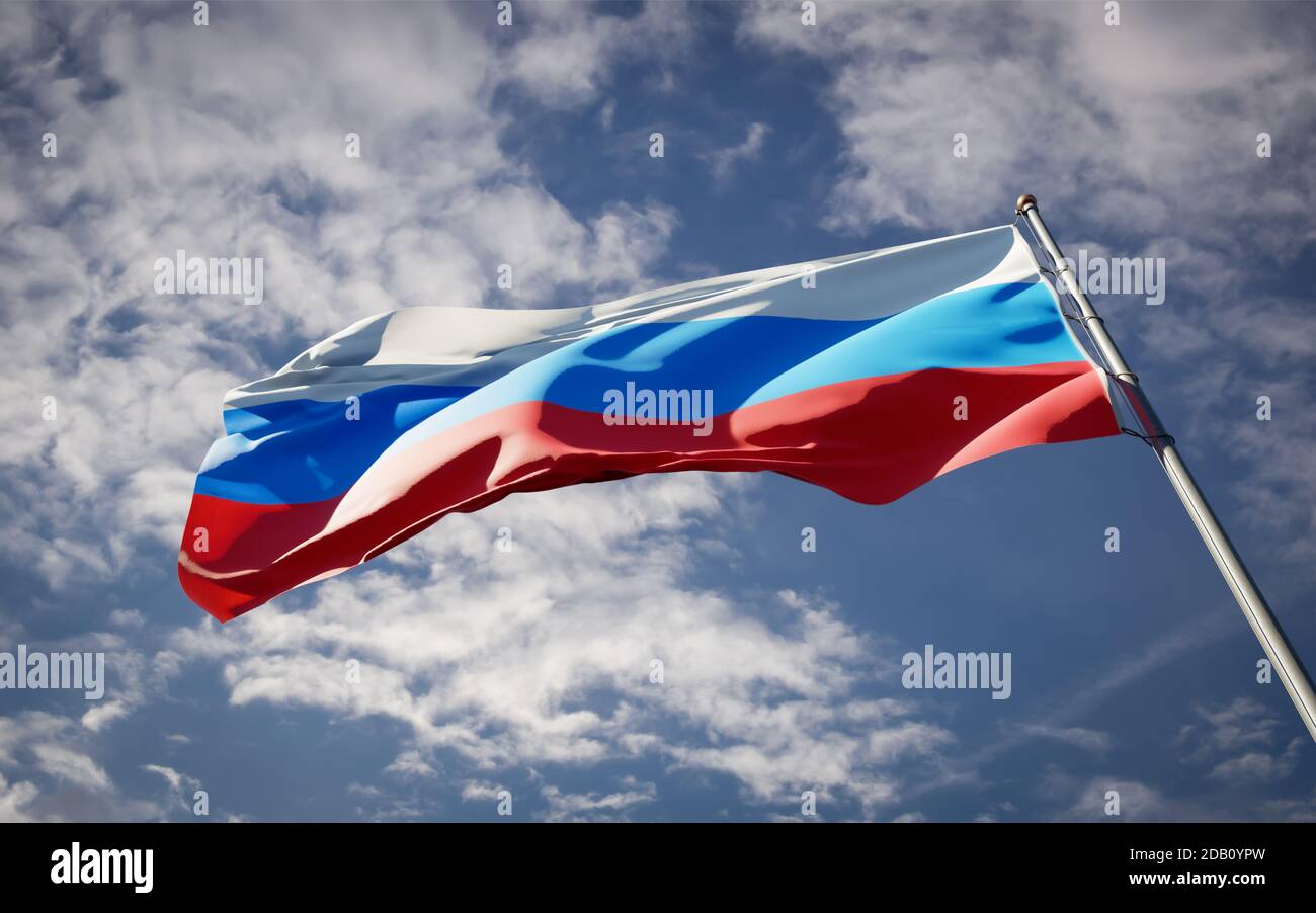 Beautiful national state flag of Russia 1993 fluttering at sky ...