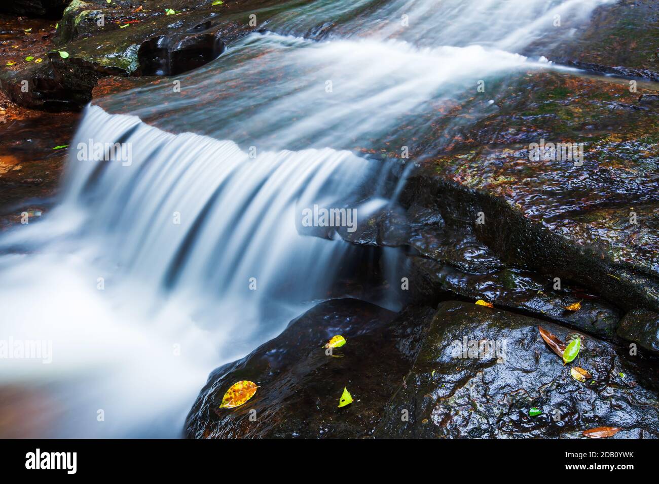 Freshwater of tropical waterfall pouring on sandstone in rain season ...