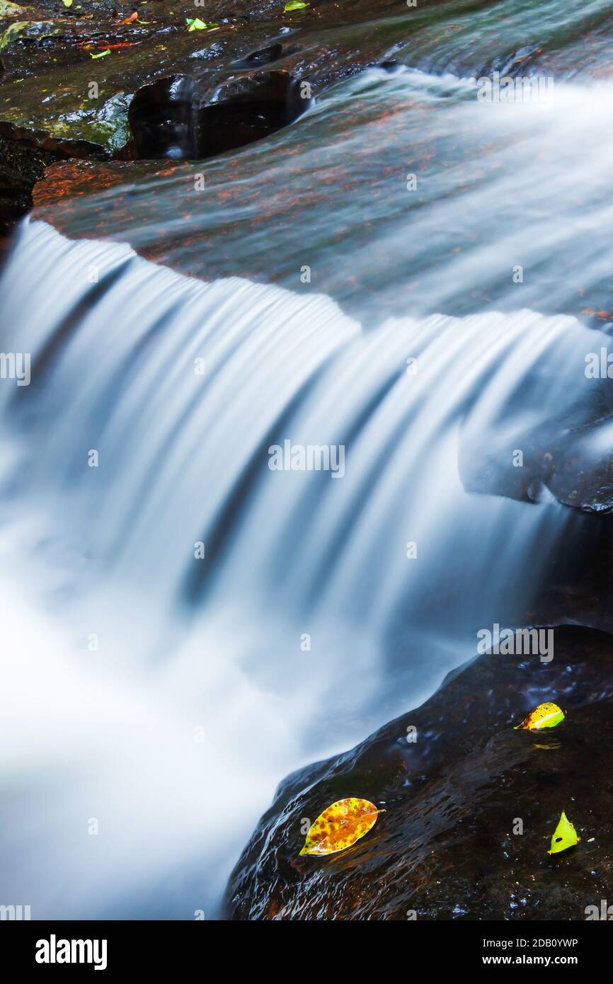Freshwater of tropical waterfall pouring on sandstone in rain season ...
