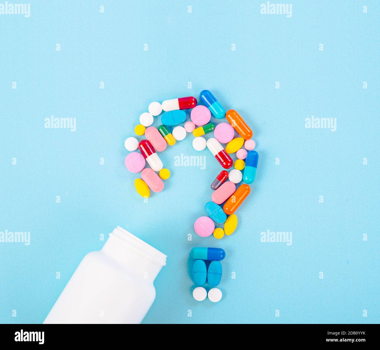 A question mark from laid out of medicine pills with bottle drug on ...