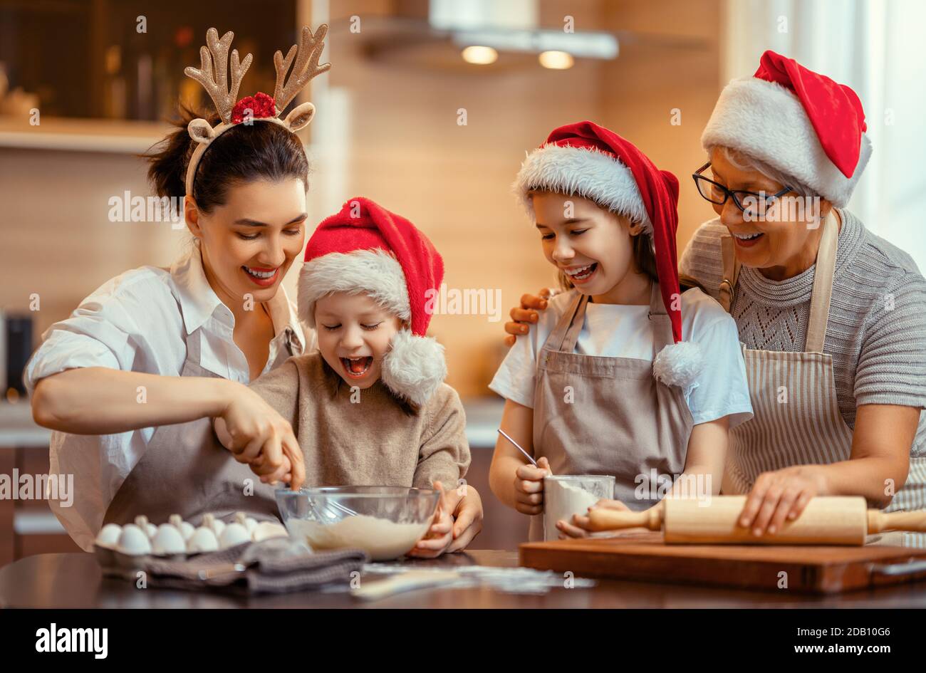 Merry Christmas and Happy Holidays. Family preparation holiday food ...