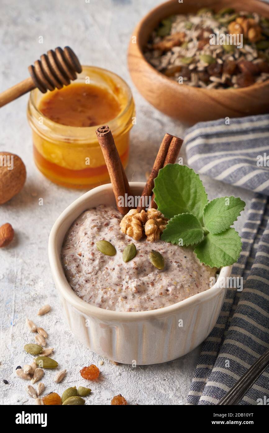 Healthy breakfast, seed and nut mix with honey and mint Stock Photo - Alamy