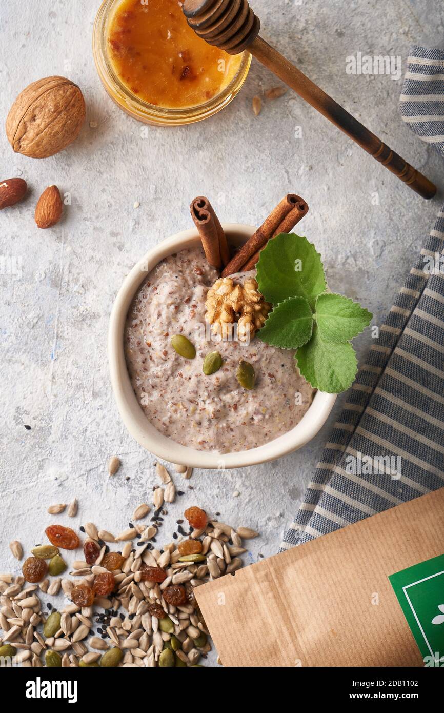 Healthy breakfast, seed and nut mix with honey and mint Stock Photo - Alamy
