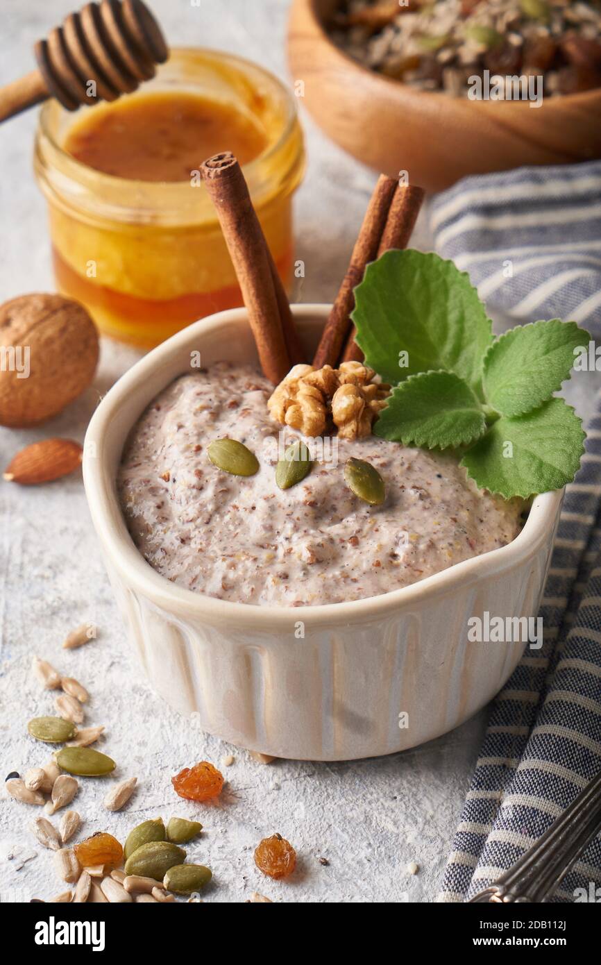 Healthy breakfast, seed and nut mix with honey and mint Stock Photo - Alamy