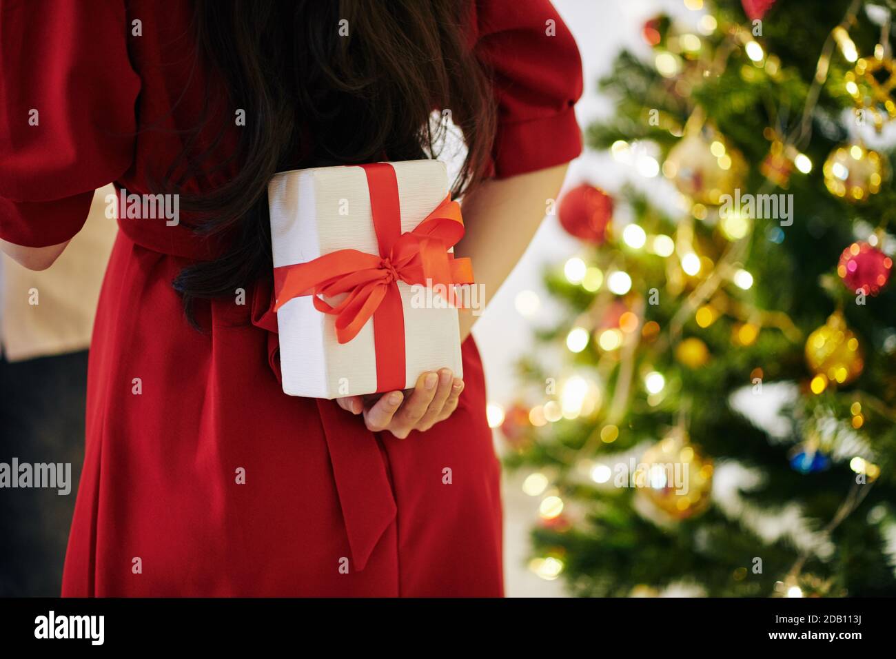 Hiding Christmas present Stock Photo - Alamy
