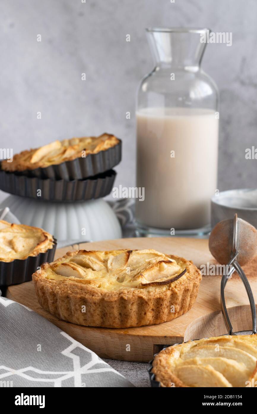 Ready to eat apple pies on grey background Stock Photo - Alamy