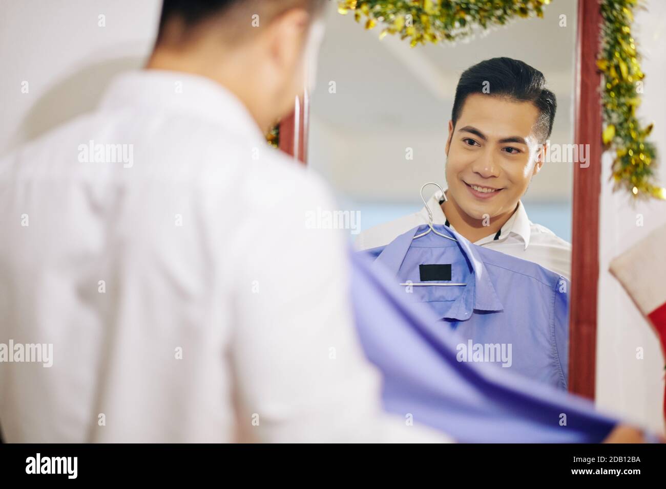 Positive young men choosing hi-res stock photography and images - Alamy