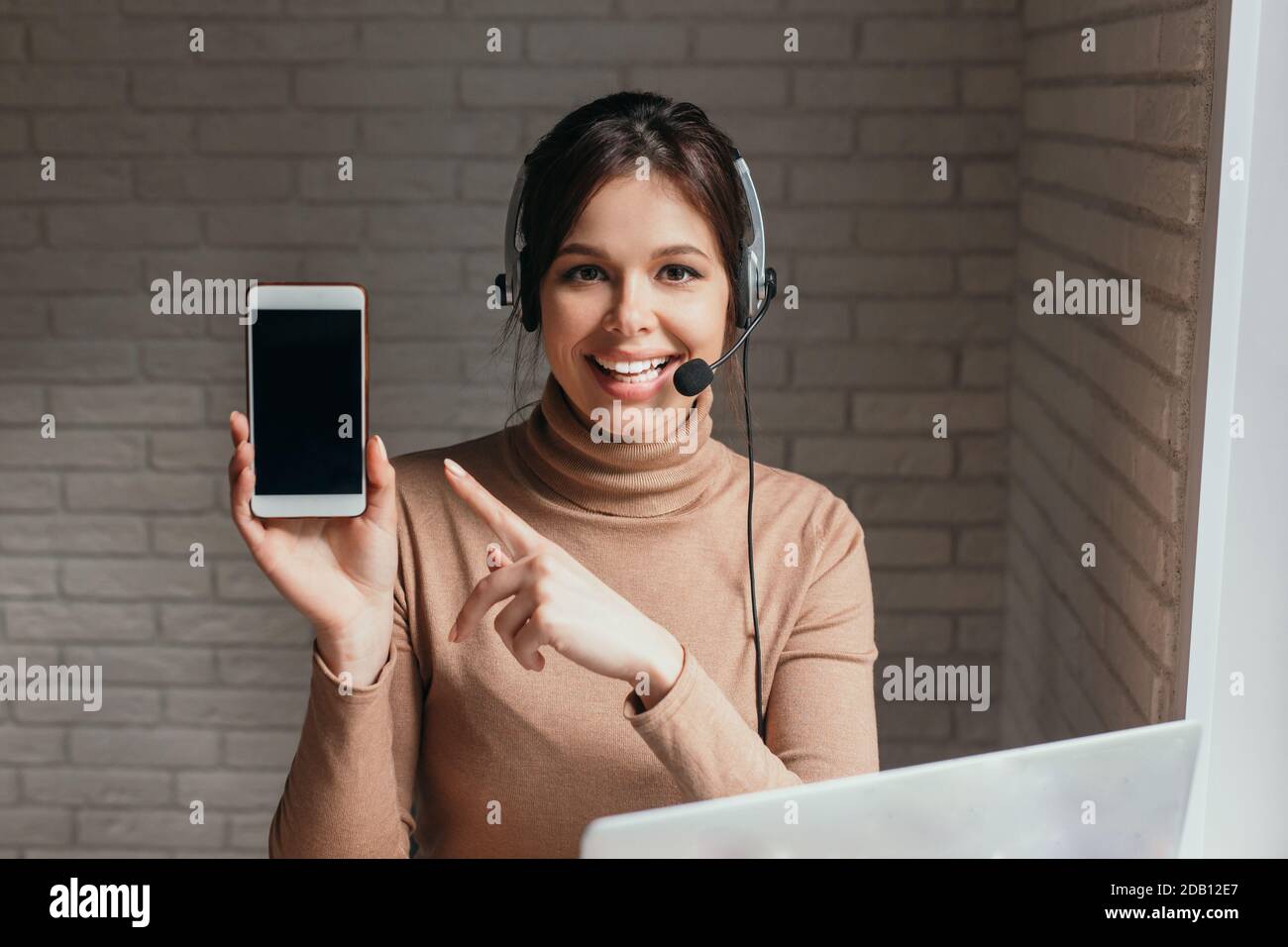 Using mobile phone to online shopping. Call center worker at office ...
