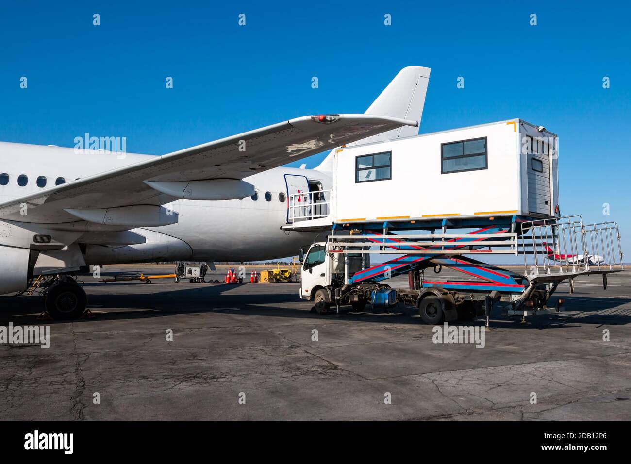 Ambulift truck for people with disabilities is at the passenger ...