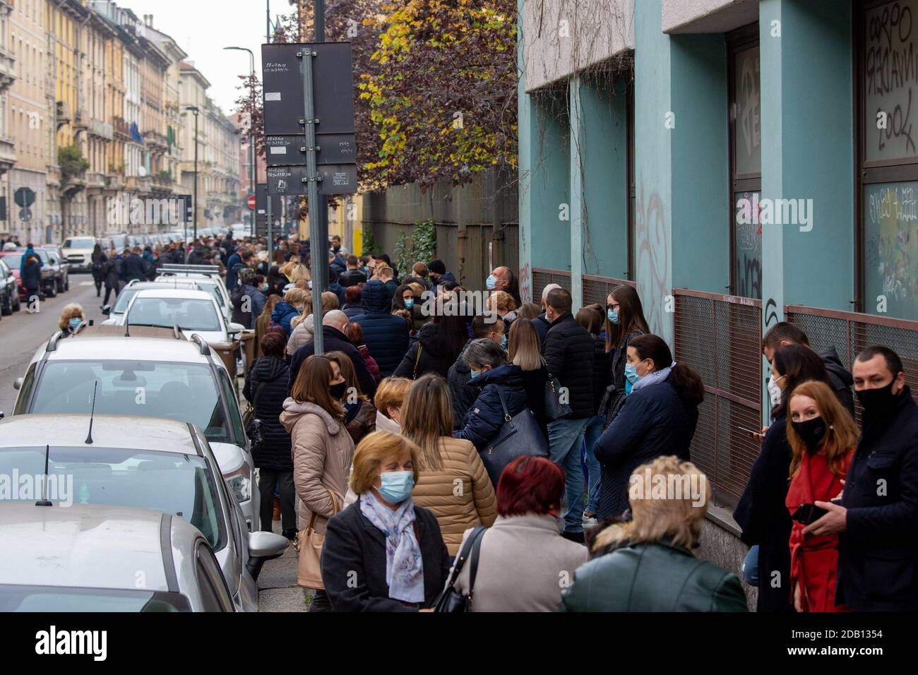MILAN,Long queue of Moldovan citizens in front of and in the streets ...
