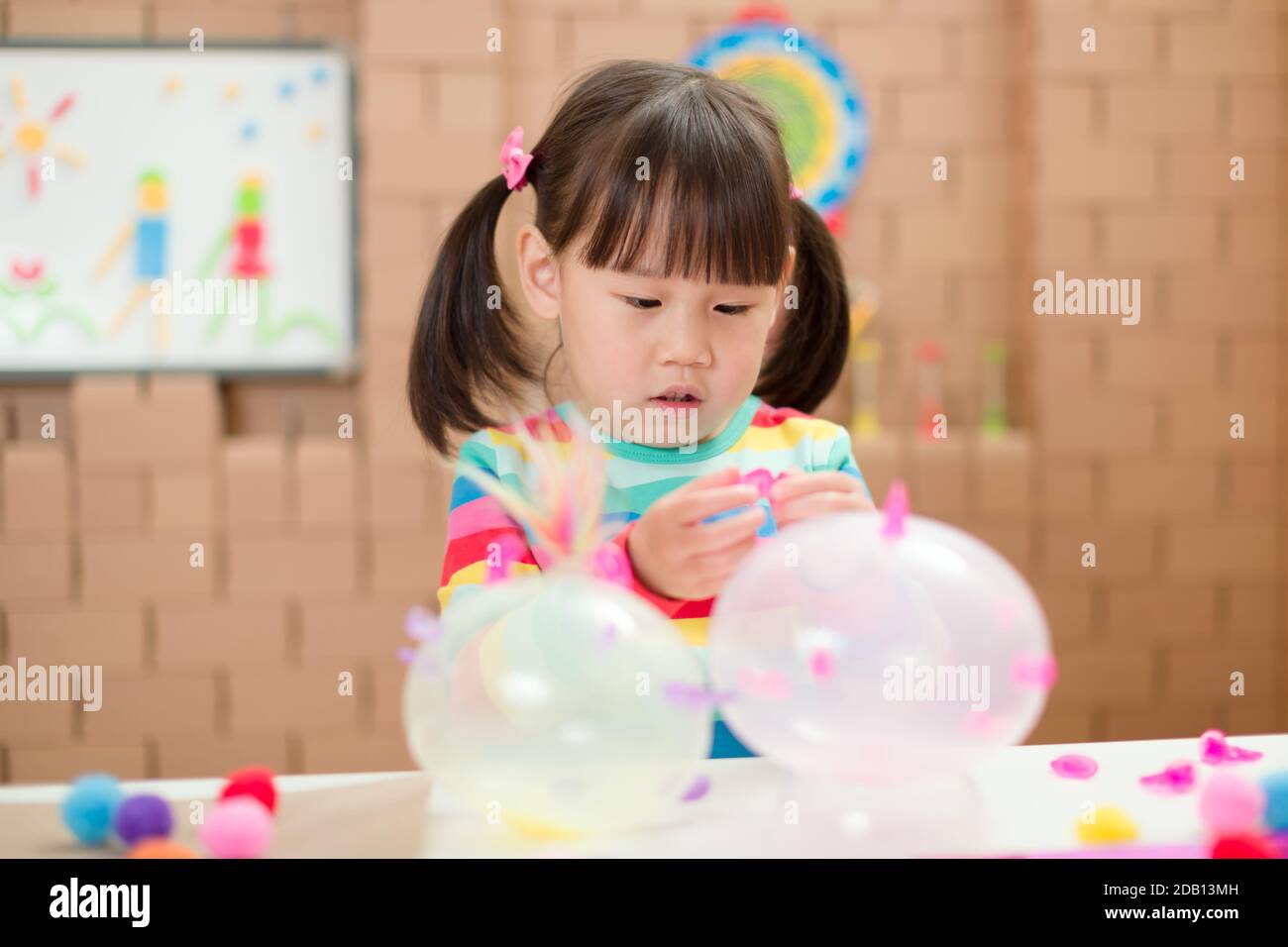 young girl making craft for homeschooling Stock Photo - Alamy