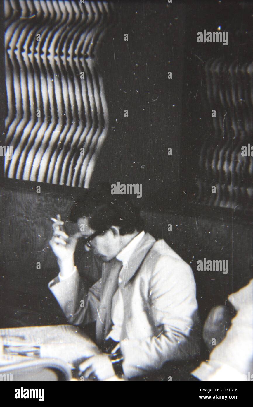 Fine 1970s vintage black and white photography of a smoker smoking in ...
